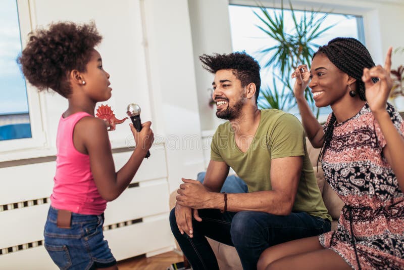 Black Family Enjoy Singing Karaoke Stock Photo - Image of family ...