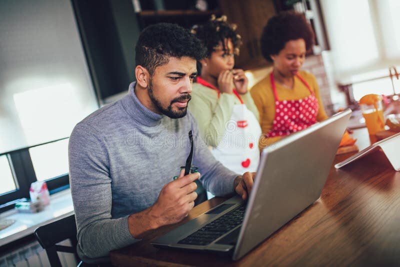 Black Family Spending Day at Kitchen. Father Using Laptop Stock Photo ...