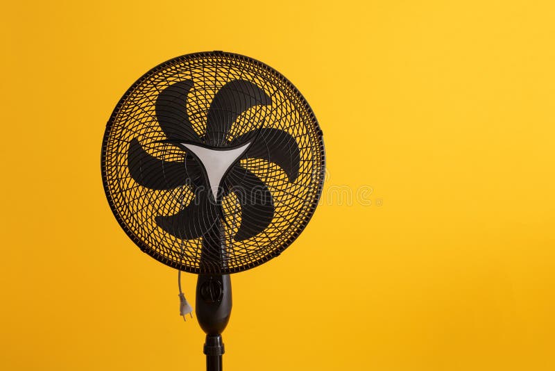 Black Fan on Yellow Background Stock Image - Image of black, blower ...