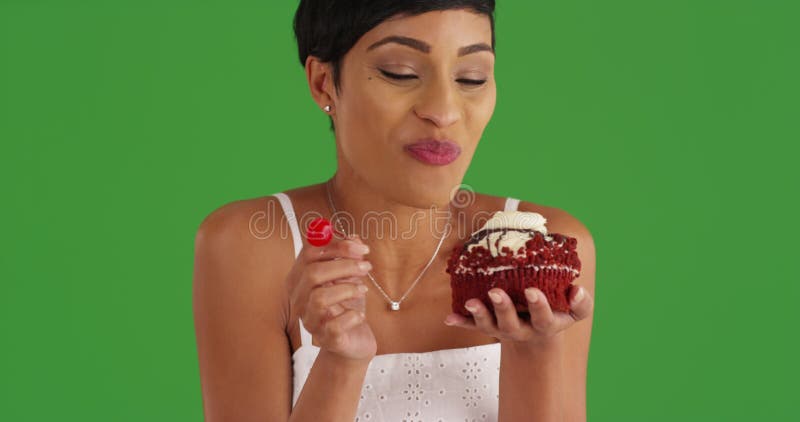 Black Female Enjoying Treat Tasting Cupcake Frosting On Green Screen Stock Footage Video Of