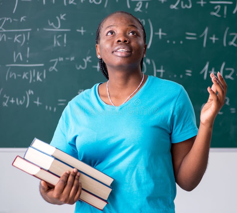 Black Female Student in Front of Chalkboard Stock Image - Image of afro ...