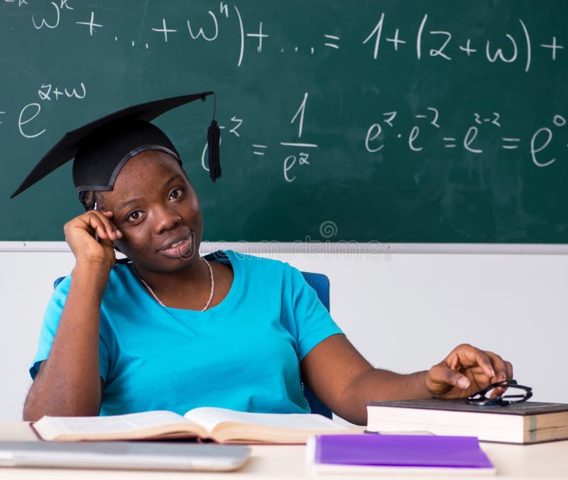 Black Female Student in Front of Chalkboard Stock Image - Image of ...
