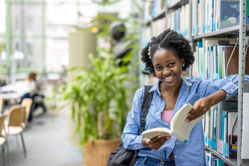 Black Female Student Reading a Book in a Library Stock Photo - Image of ...