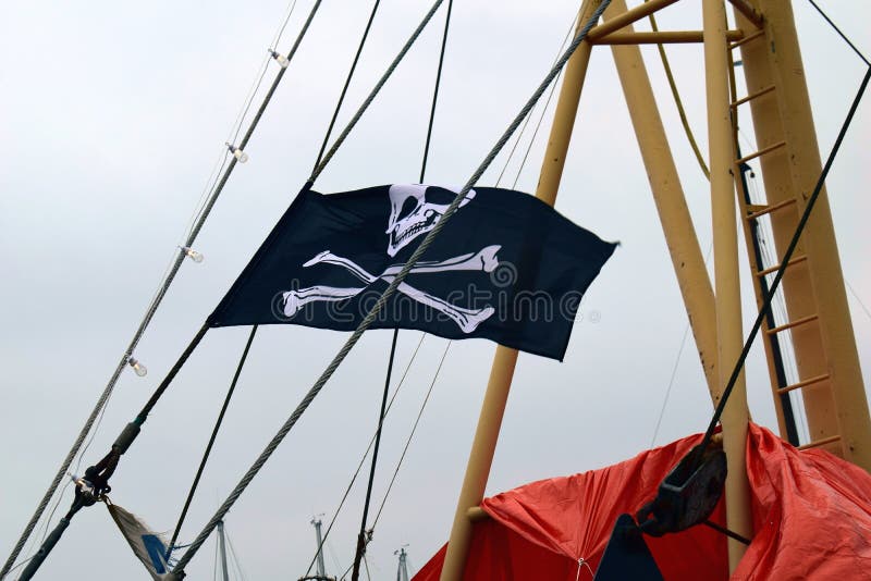 Waving a black pirate flag editorial stock photo. Image of journey ...
