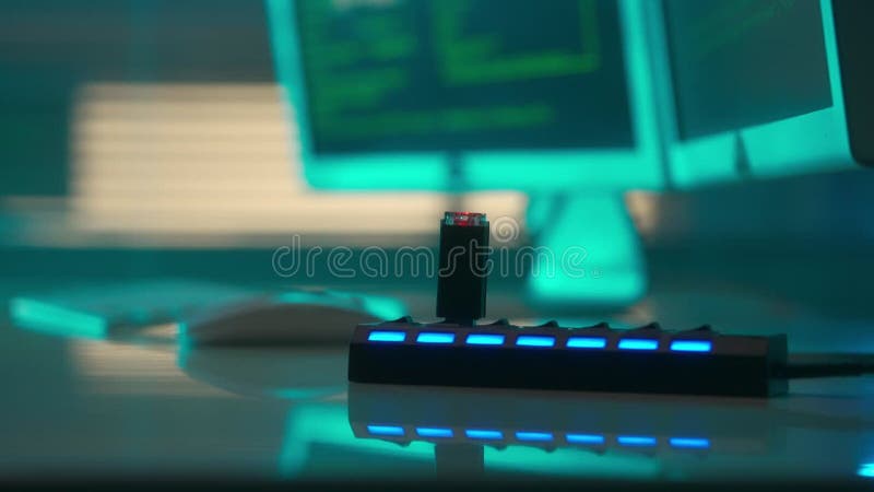 A Black Flash Drive with a Red Flashing Light is Inserted into the USB ...