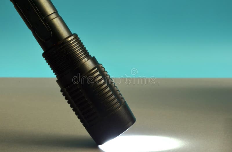 A Black Flashlight Shines on a Gray Background. Stock Image - Image of ...