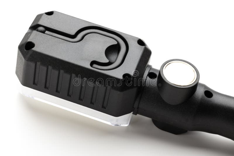 A Black Flashlight with a Textured Body and a Clear Lens on a White ...