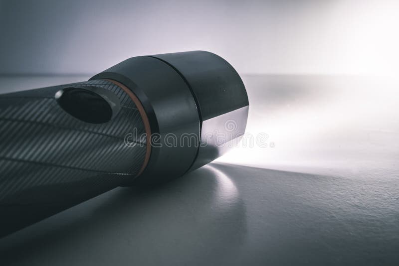 Black Flashlight Turned on stock image. Image of flashlight - 113907849