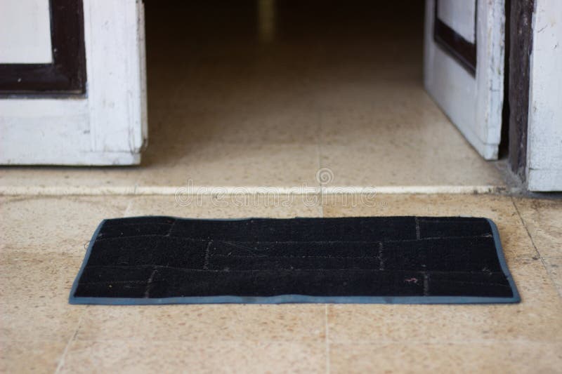 Black Floor Mat in Front of the House Door Stock Photo - Image of ...
