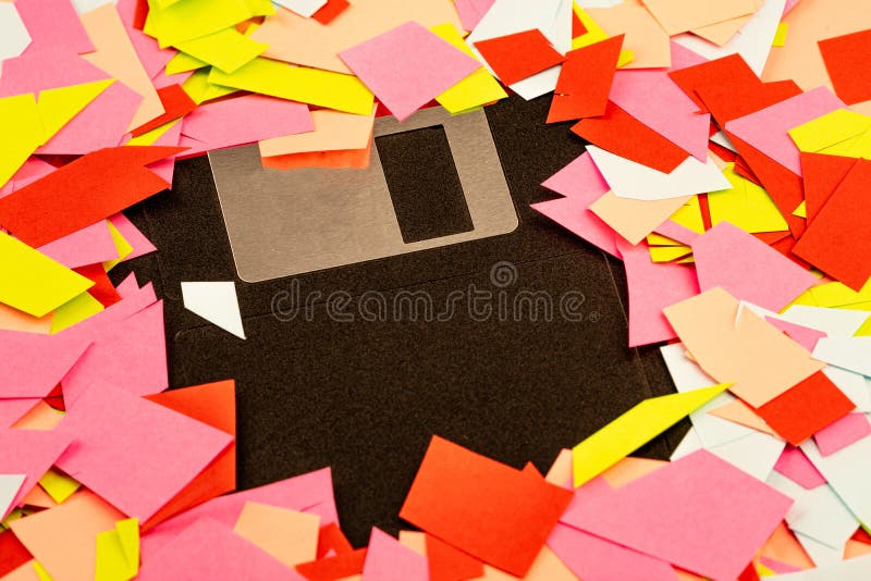 Black Floppy Disk in Multi-colored Pieces of Paper Stock Image - Image ...
