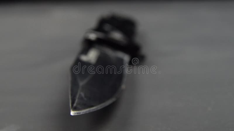 Black Folding Knife on a Black Surface Table Sharp Edge Blade Stock ...