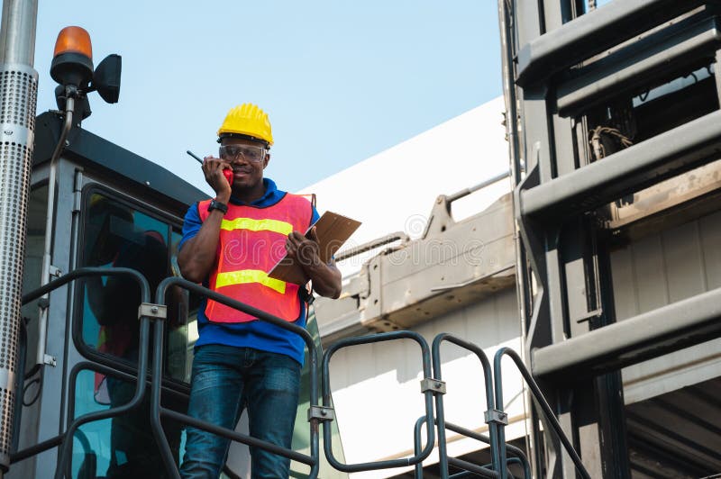 Black Foreman Worker Working Control the Crane and Forklift at ...