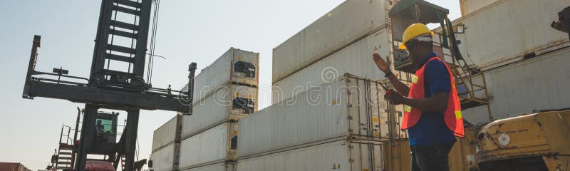 Black Foreman Worker Working Control the Crane and Forklift at ...