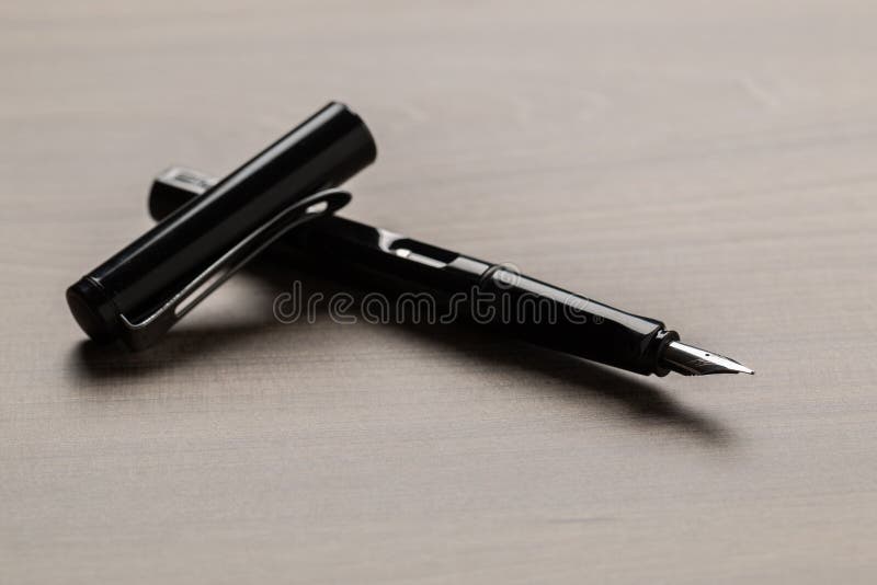 Fountain pen on table stock photo. Image of black, note - 138973748