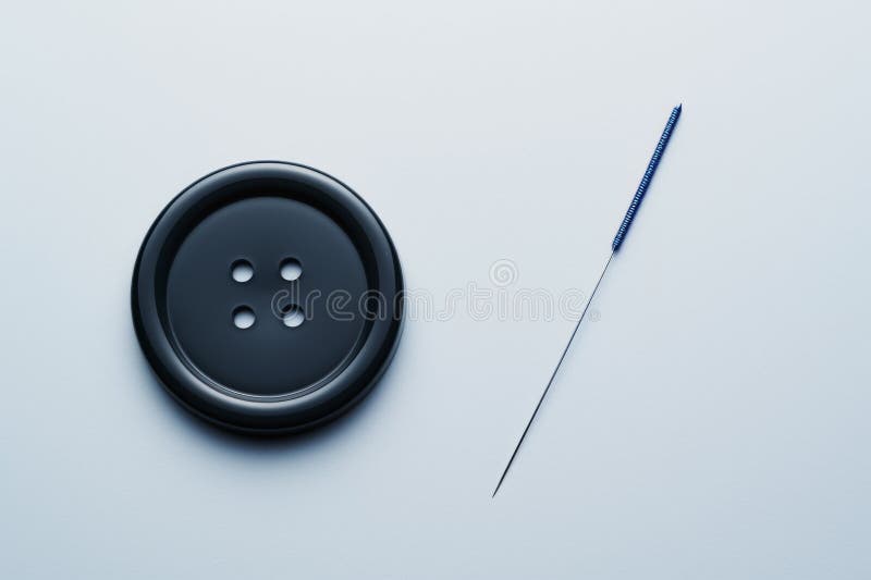 Needle with Threaded Yellow Thread Passing the Thread through a Black ...