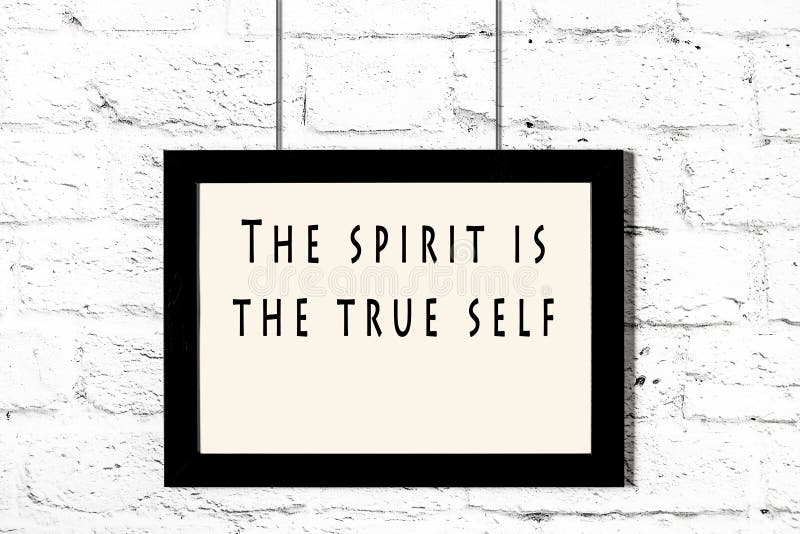 Black Frame with Wise Quote Hanging on a White Brick Wall Stock ...