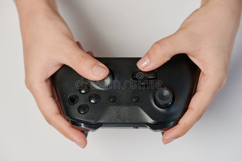 Black Game Controller in Hand Stock Photo - Image of entertainment ...