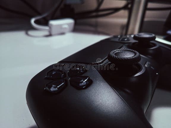 Black Game Controllers on a White Desk Stock Image - Image of ...