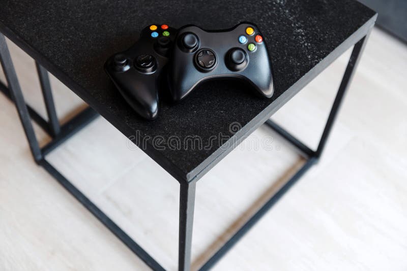 Black Gaming Controllers on Modern Table Stock Photo - Image of ...