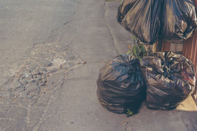 Black Garbage Bag on the Street. Stock Photo - Image of environment ...