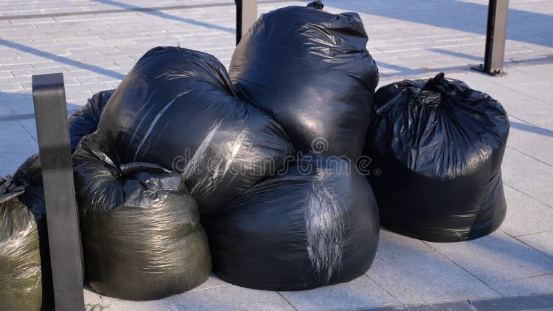 Black Garbage Bags Stack on a Park Stock Video - Video of junk, group ...
