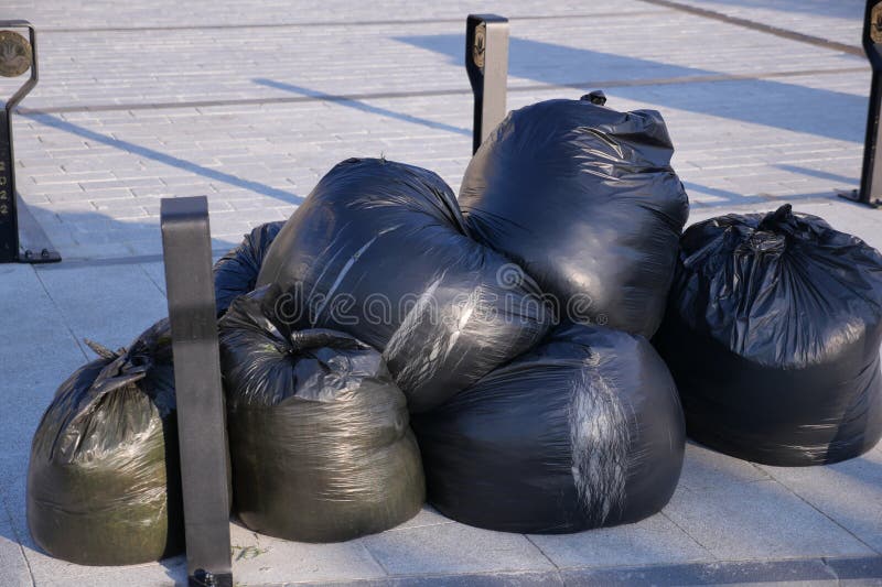 Black Garbage Bags Stack on a Park Stock Image - Image of pile ...