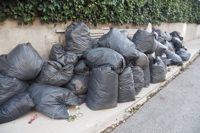 Black Garbage Bags Stack on a Park Stock Photo - Image of packages ...