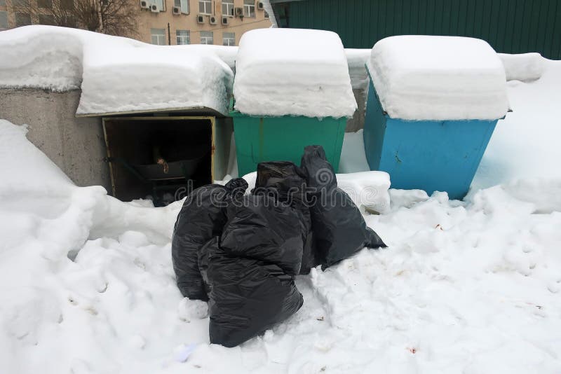 Black Garbage Bags in the Trash in the Snow Stock Image - Image of ...