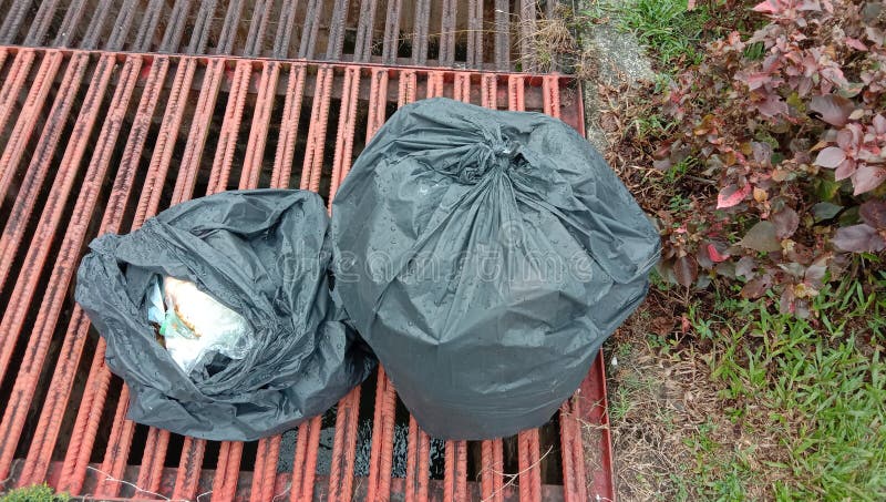 Black Garbage Plastic Placed on Top of the Red Drain Cover Stock Image ...