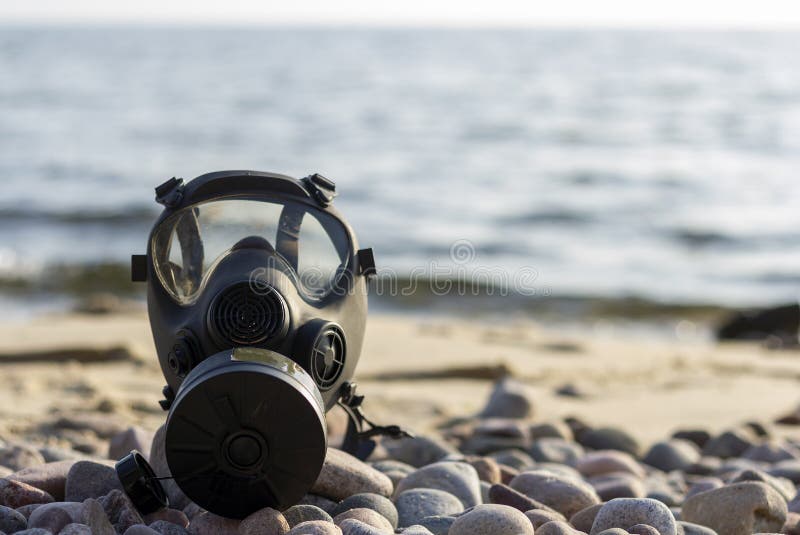 A Gas Mask on a Rocky Beach Stock Photo - Image of outdoors, attack ...