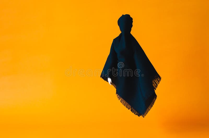 Black Ghost Sheet Flying on Orange Background. Stock Image - Image of ...
