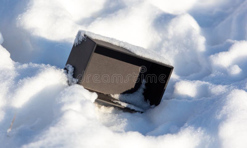 Black gift box in the snow stock image. Image of year - 239775137