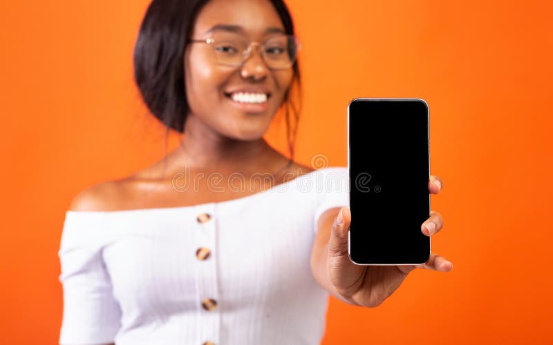 Black Girl Showing Phone Empty Screen Standing, Orange Background ...