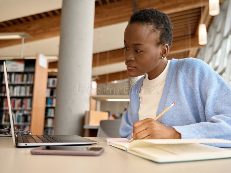 Black Girl Student Using Laptop Learning Online Sitting at Desk in ...