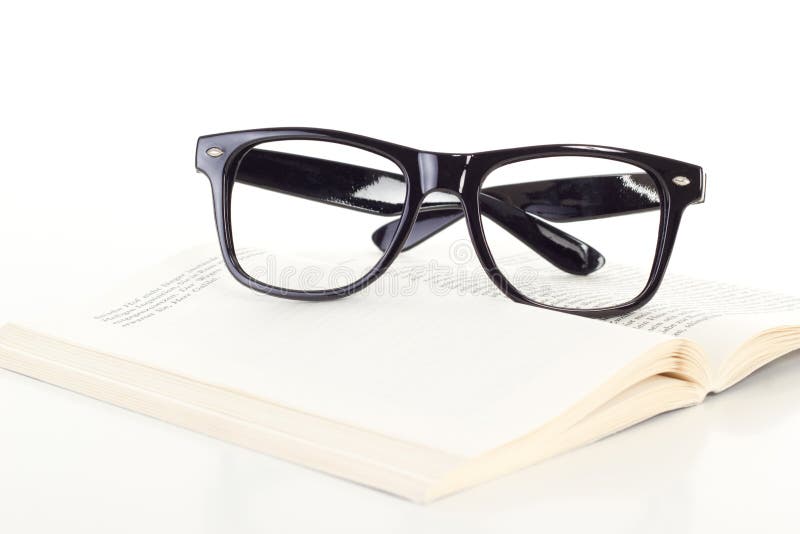Black glasses on open book stock photo. Image of books - 33415092