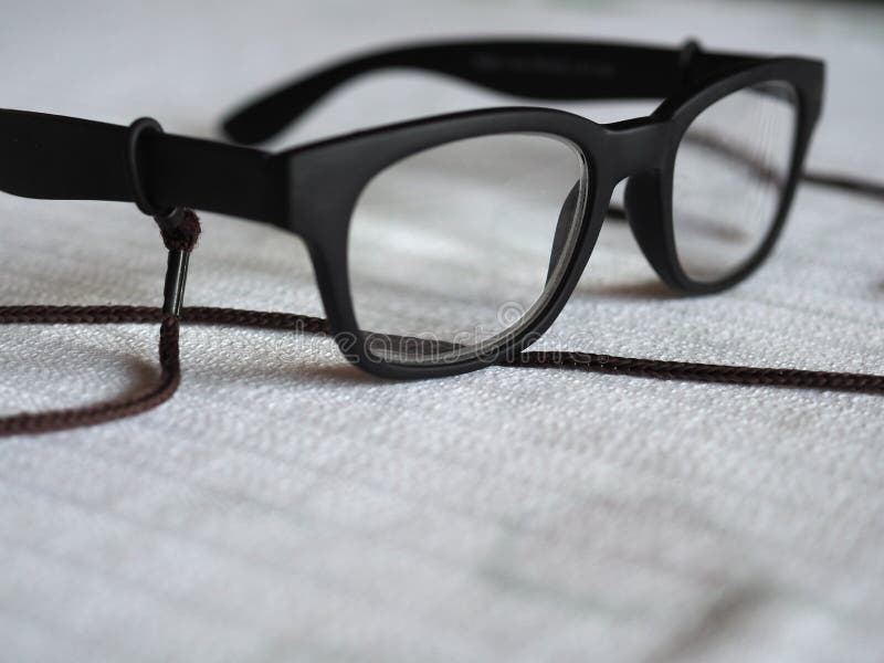 Black glasses on table stock photo. Image of object - 154325752