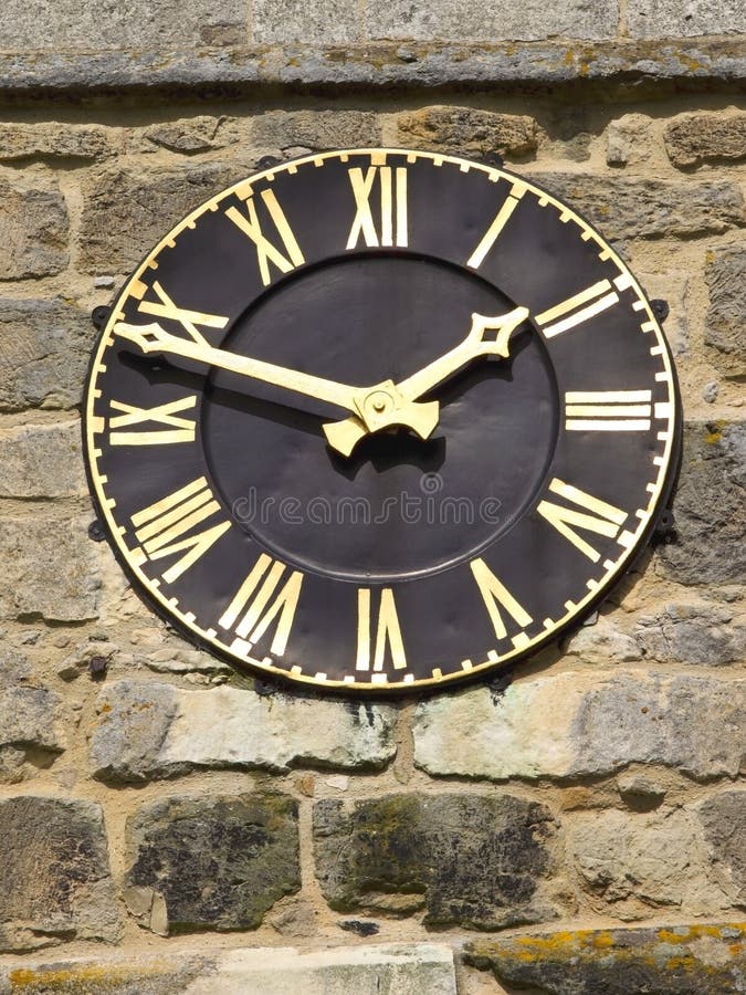 A black and gold clock stock image. Image of gold, numbers - 10667913