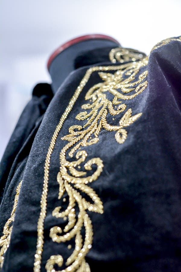 Gold batik black suit stock photo. Image of gold, brown - 264274228