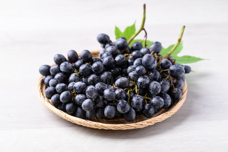 Black Grapes in Basket on White Table Stock Photo - Image of summer ...