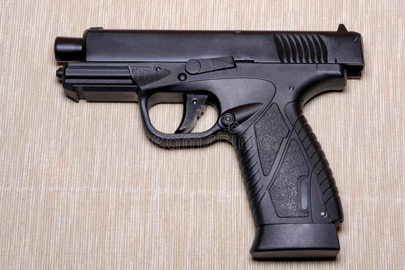 Black Gun Isolated on Light Coloured Background Stock Photo - Image of ...