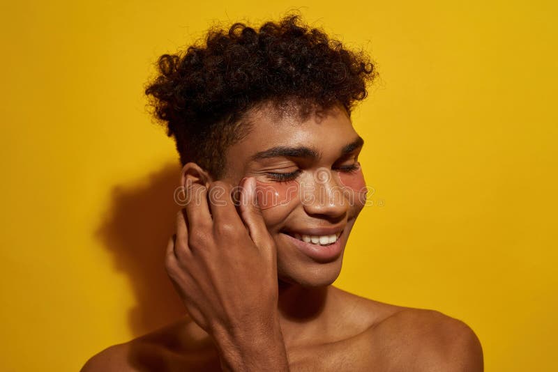 Black Guy Apply or Correct Under Eye Patch on Face Stock Photo - Image ... Black Guy Apply or Correct Under Eye Patch on Face Stock Photo - Image ...