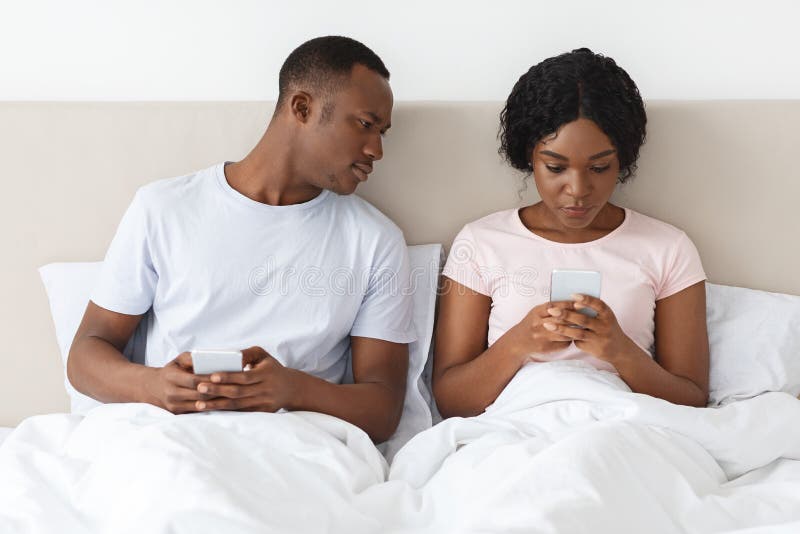 Black Guy Eavesdropping on His Girlfriend Using Mobile Phone Stock ...