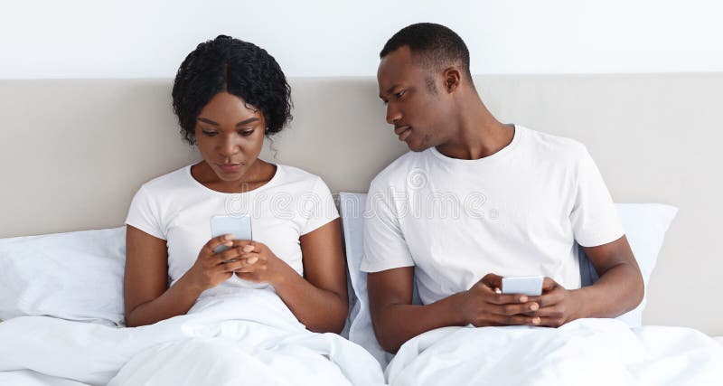 Black Guy Eavesdropping on His Girlfriend Using Mobile Phone Stock ...