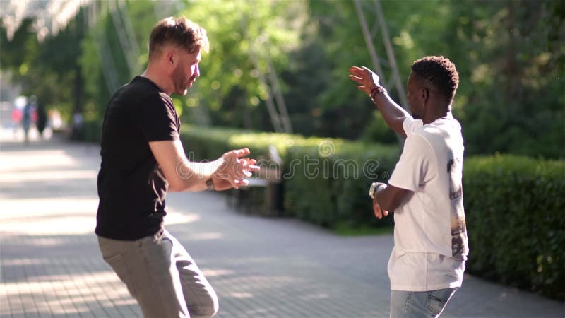 A Black Guy and a White Guy Say Hello in a Special Way and Have Fun ...