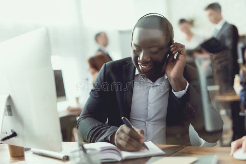A Black Guy Works As a Call Center Operator. Stock Photo - Image of ...