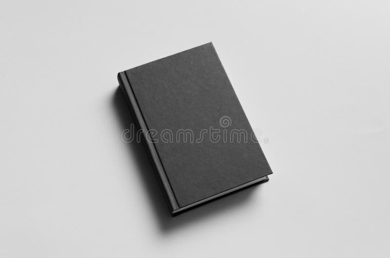 Black Hardcover Book on Wooden Surface - Mock-up Black Book Stock Image ...