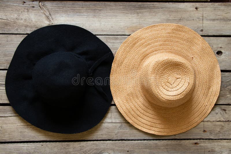 Black Hat and Straw Hat on Wooden Table ,two Different Hats ,fashion ...