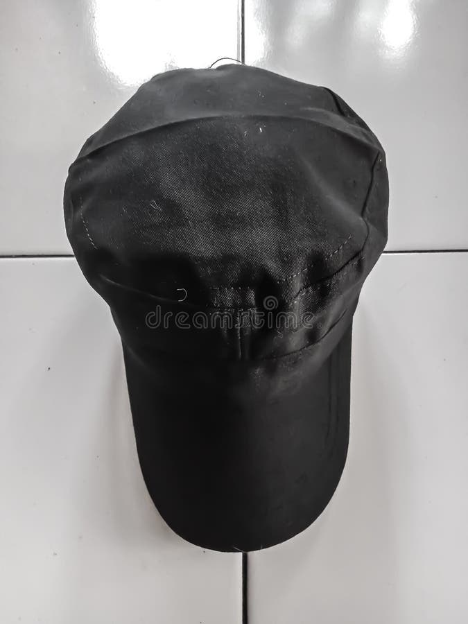Black Hat on the White Tiled Floor Stock Photo - Image of floor, tiled ...