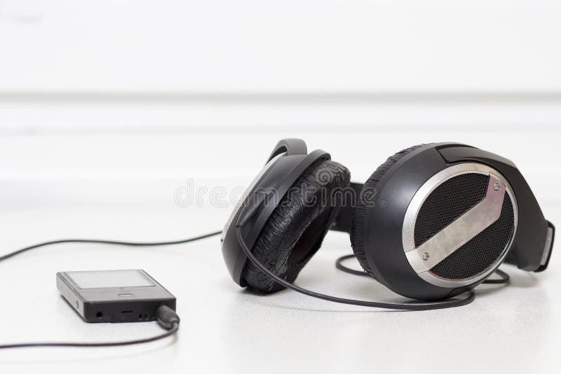 Headphones and player stock image. Image of headphones - 562977