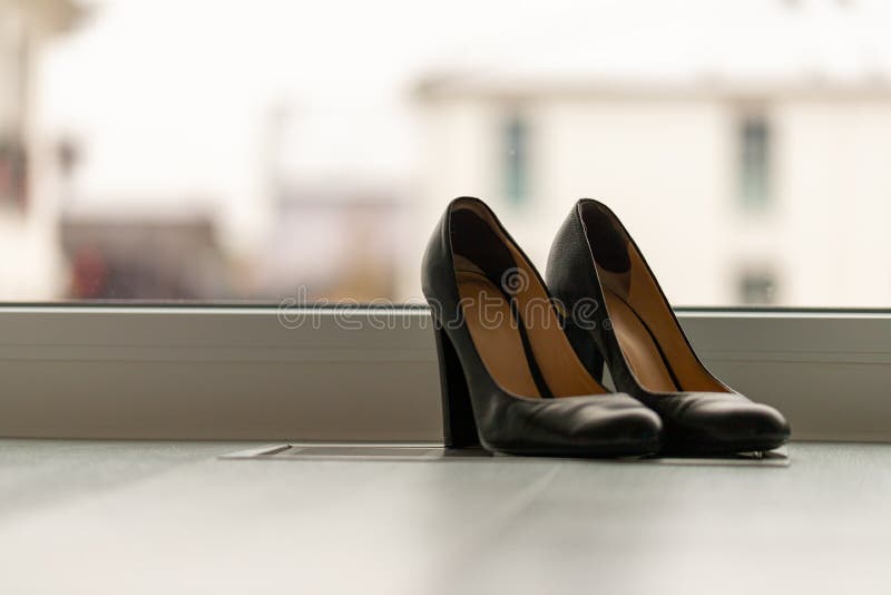 Black High Heel Pumps in Front of a Window and on a Light Floor Stock ...